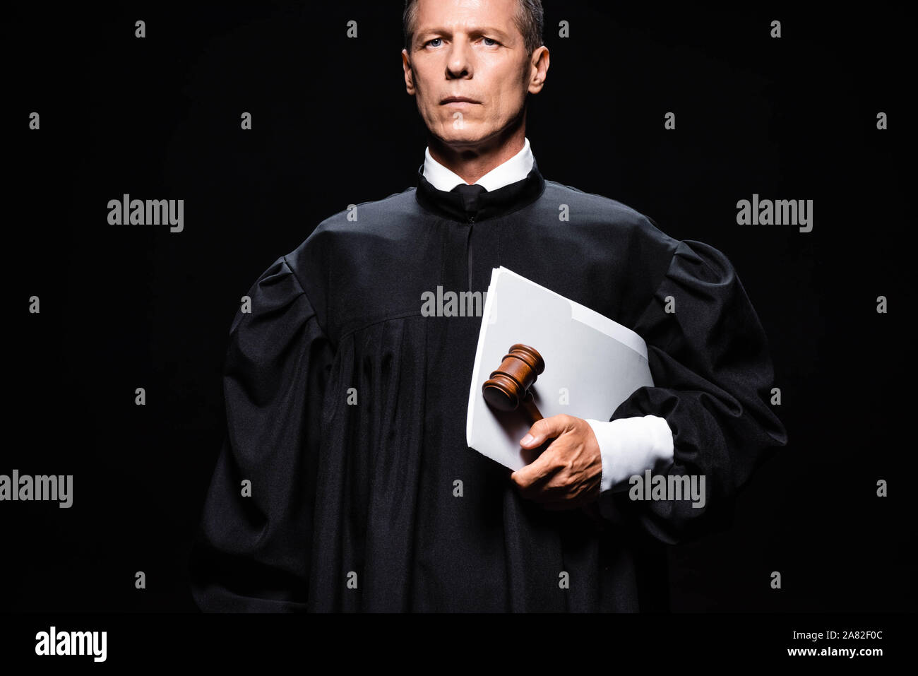 Middle-aged judge holding gavel Stock Photo - Alamy