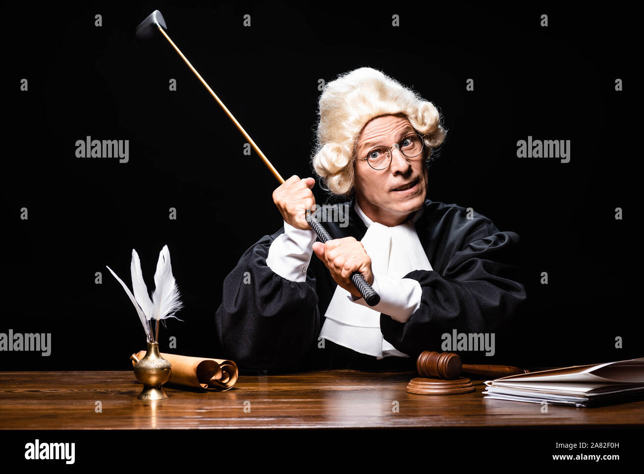 angry judge in judicial robe and wig holding golf club isolated on ...