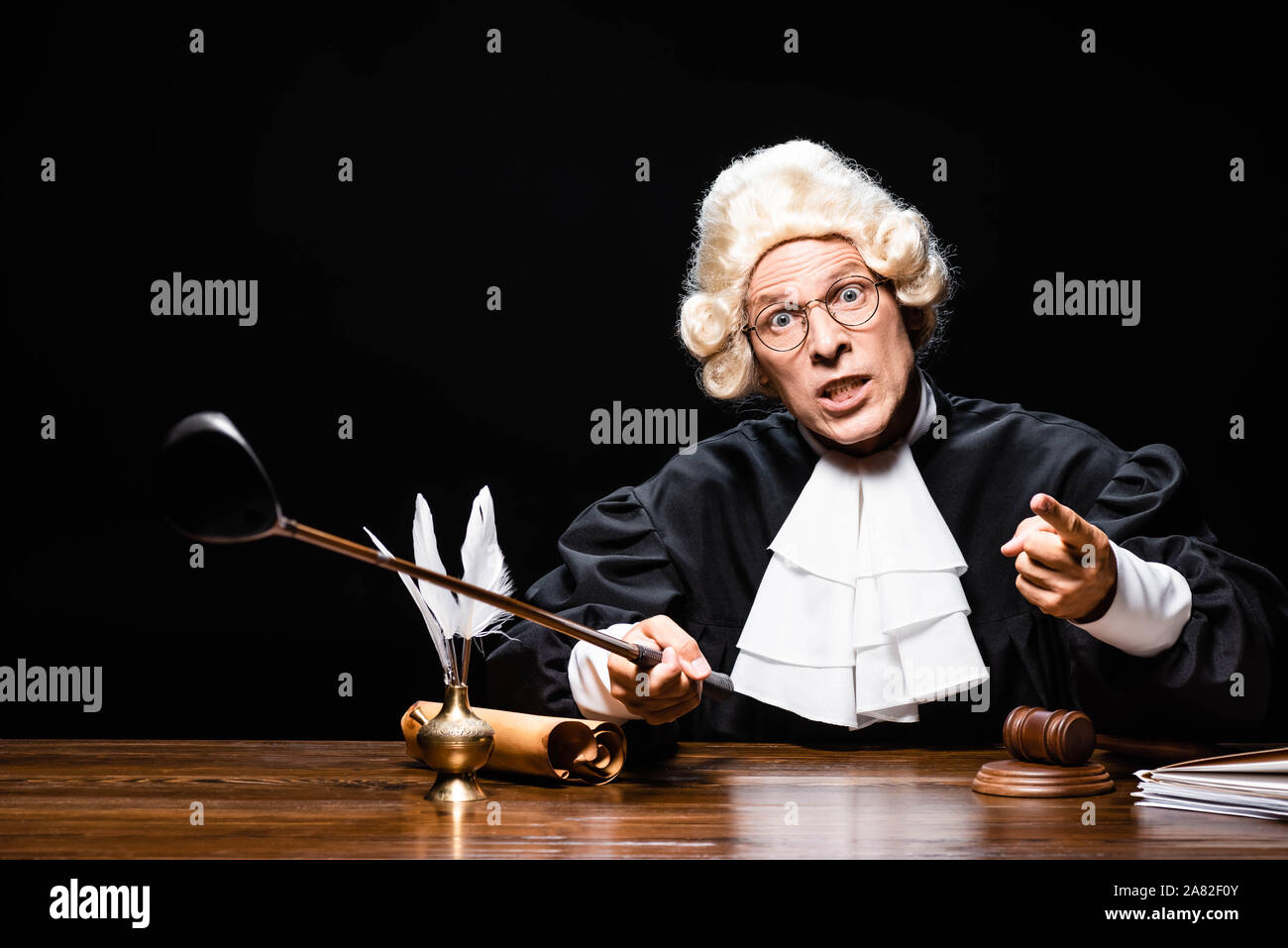 angry judge in judicial robe and wig holding golf club and pointing ...