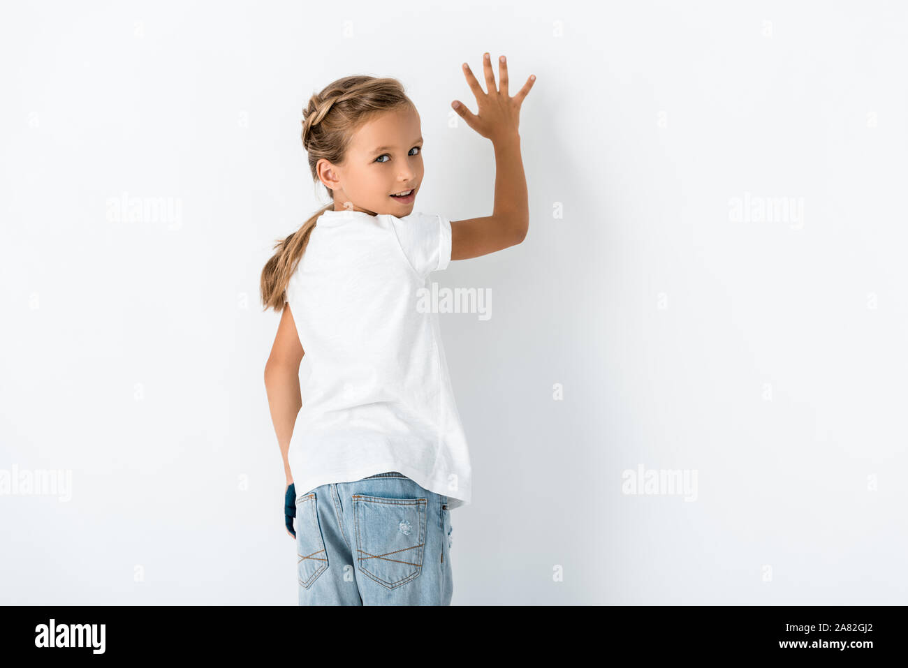 happy kid looking at camera on white Stock Photo - Alamy