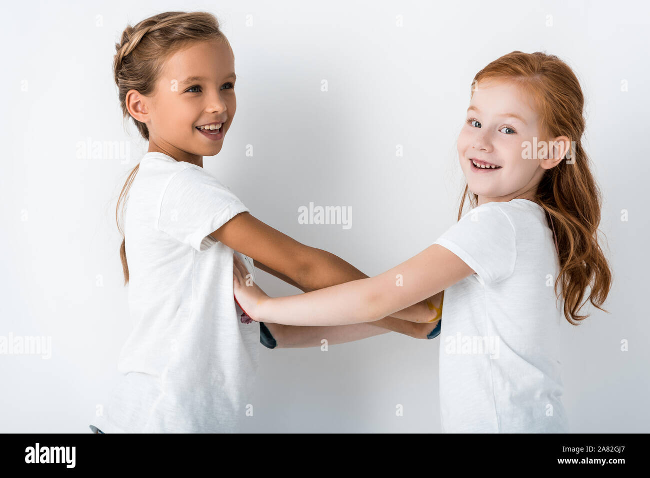 cheerful kids smiling standing standing on white Stock Photo - Alamy