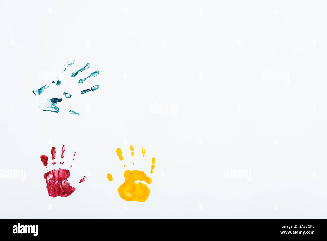 yellow, red and blue hand prints on white Stock Photo - Alamy