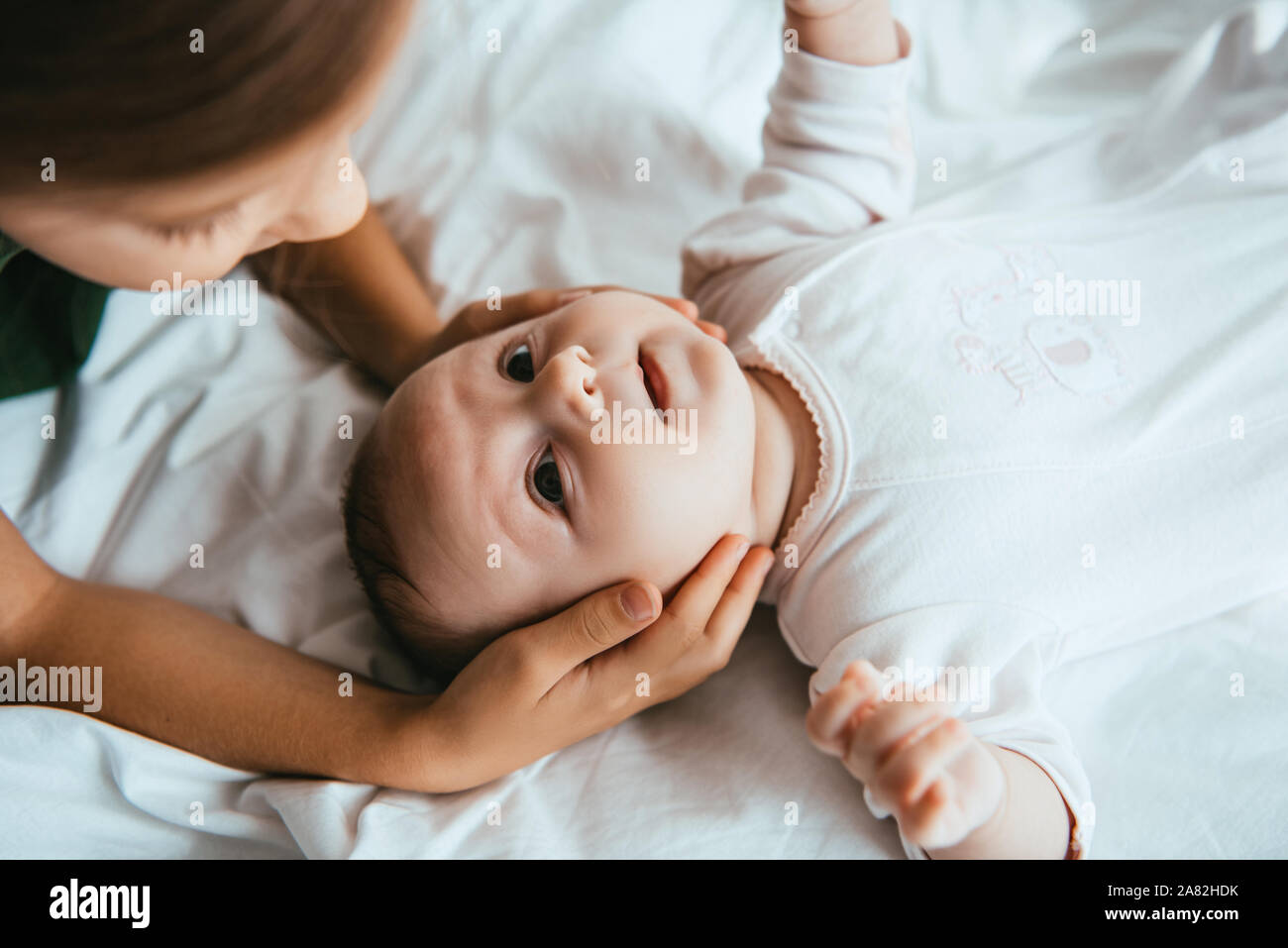 Child touching head hi-res stock photography and images - Alamy