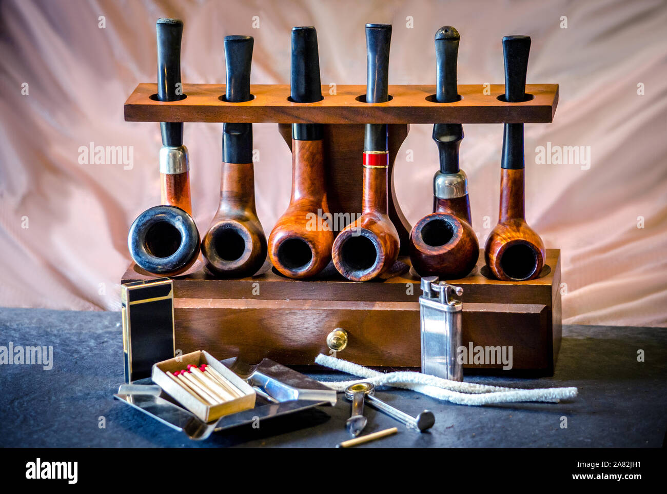 classic pipes on wood rack with tools Stock Photo - Alamy