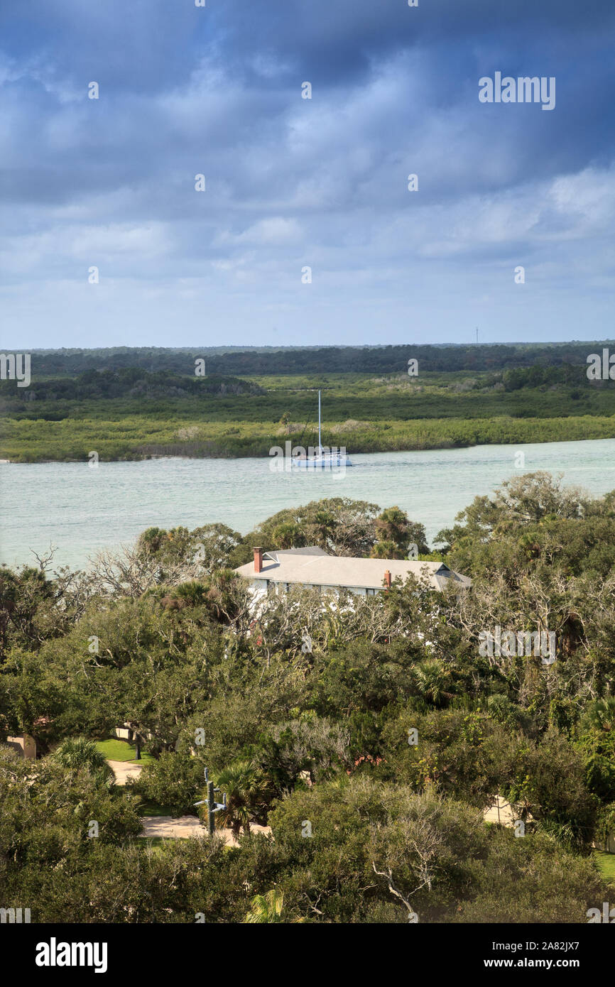 Sailboat sails through Ponce de Leon Inlet in an aerial view of New ...
