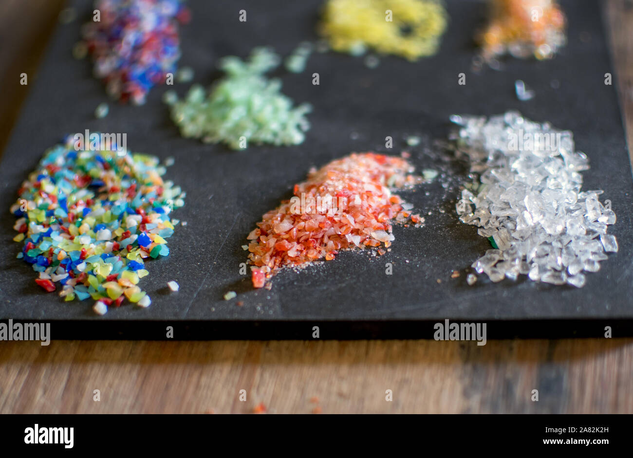 Close up of glass frit, the tiny particles of color that are often ...