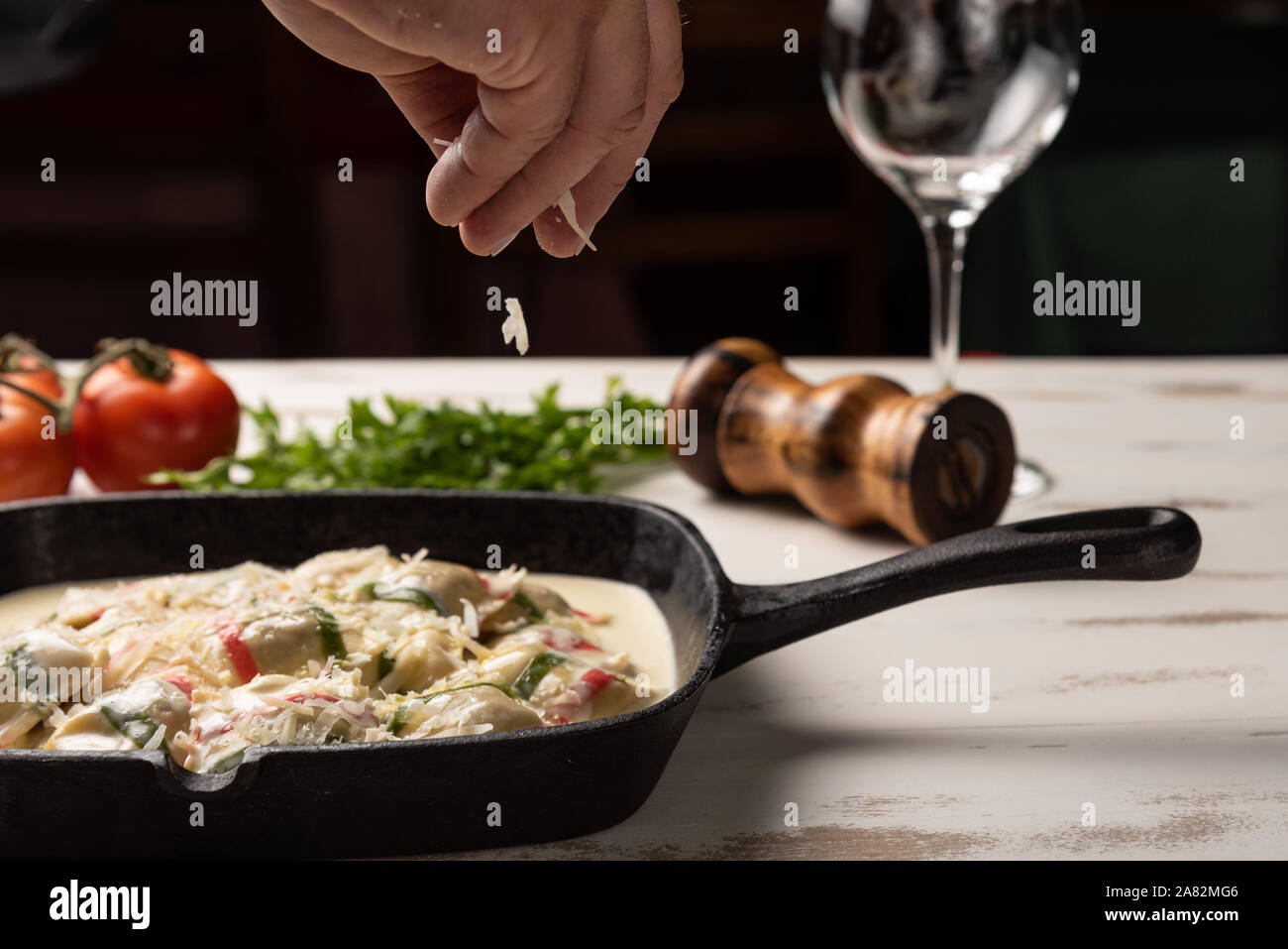 Handmade color ravioli pasta; Multi-colored ravioli pasta in a black ...