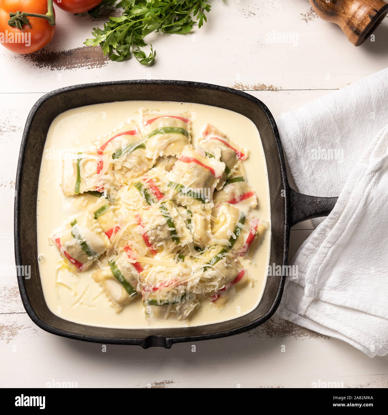 Handmade color ravioli pasta; Multi-colored ravioli pasta in a black ...