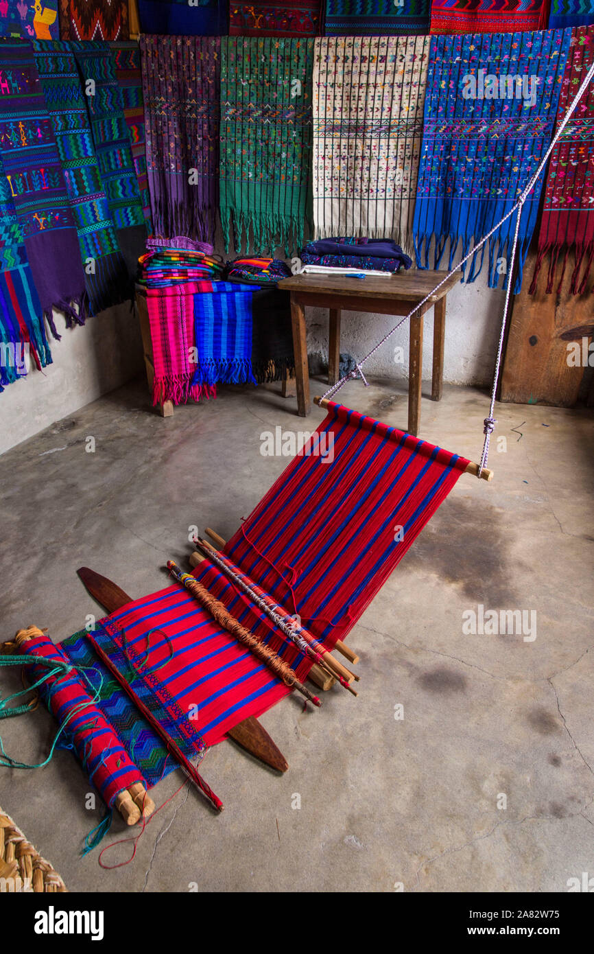 A backstrap loom set up in a small, home weaving shop in Santa Catarina ...