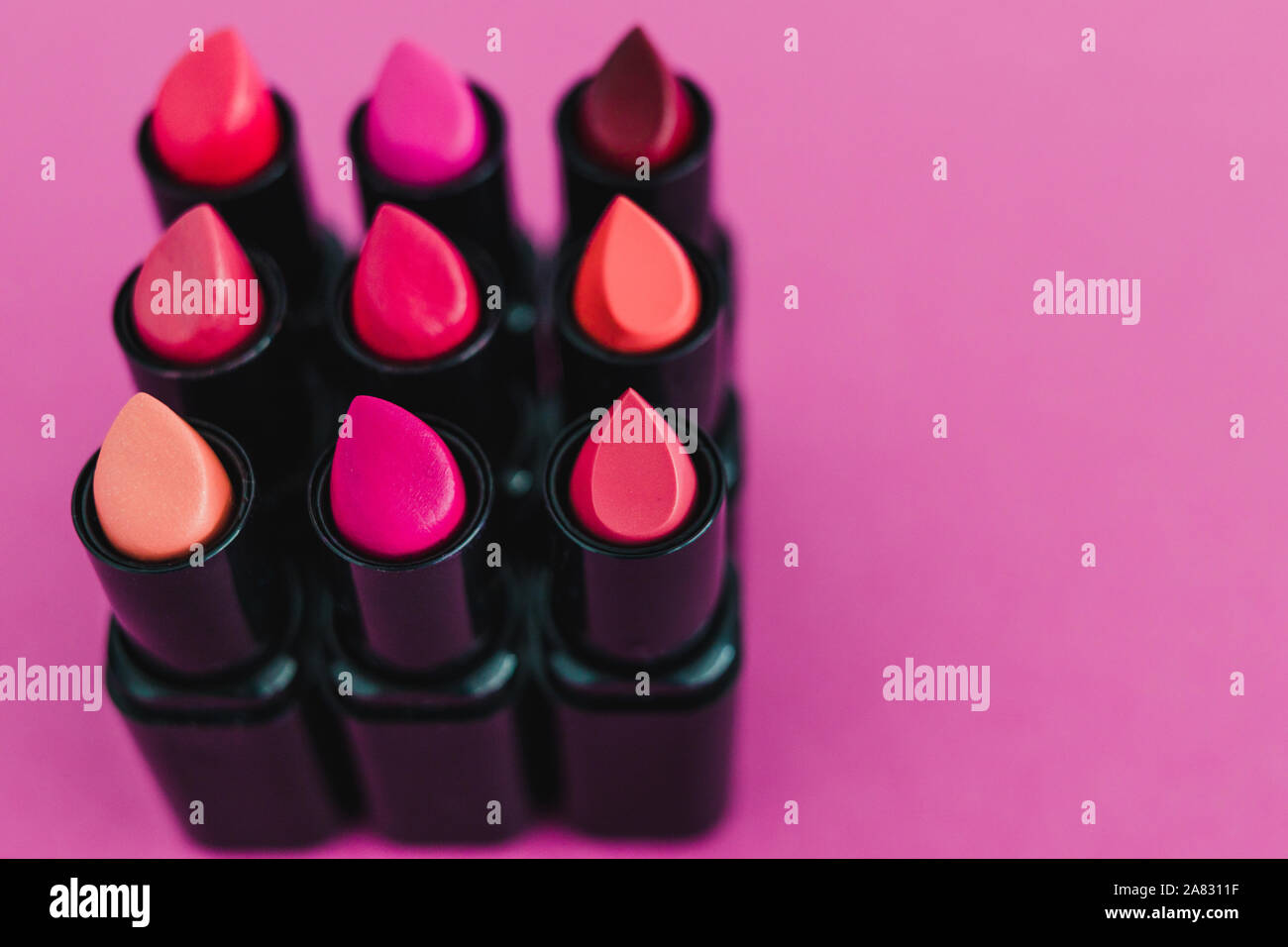 make-up and beauty industry still-life with group of colorful lipsticks ...