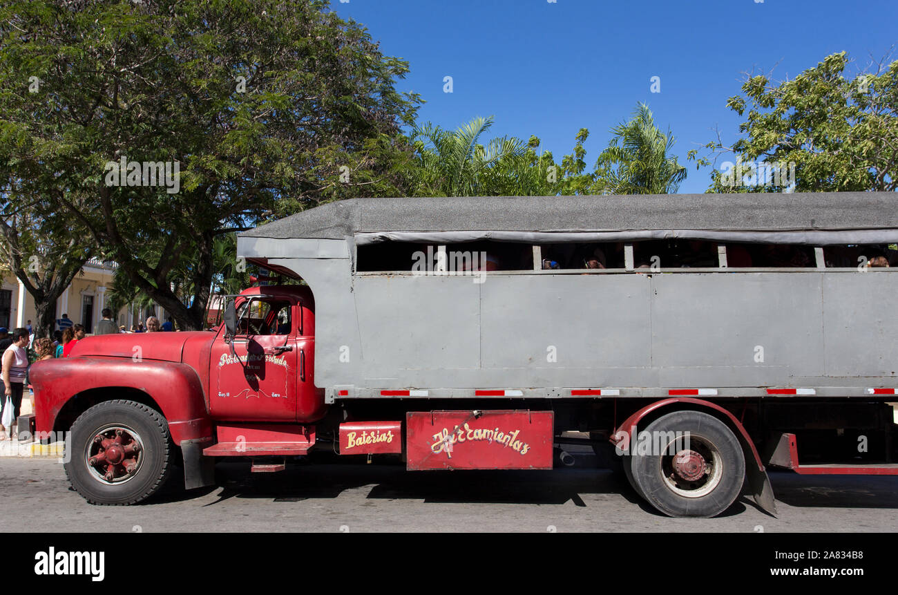 HOLGUIN, CUBA - DECEMBER 28, 2015: People ride truck buses (camion) in ...