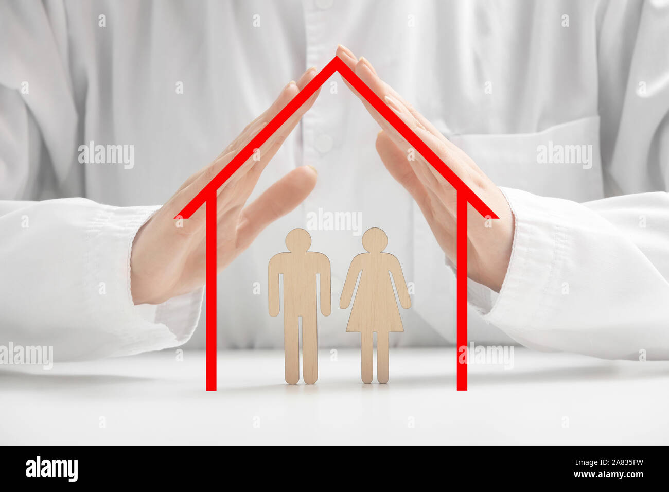 Female doctor with human figures on table, closeup. Health insurance ...