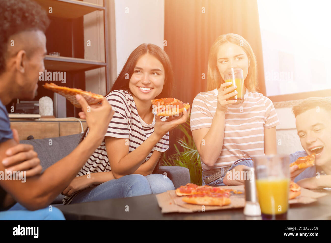 Group young people eating traditional hi-res stock photography and ...