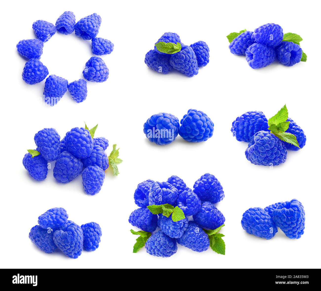 Set with fresh blue raspberry on white background Stock Photo - Alamy
