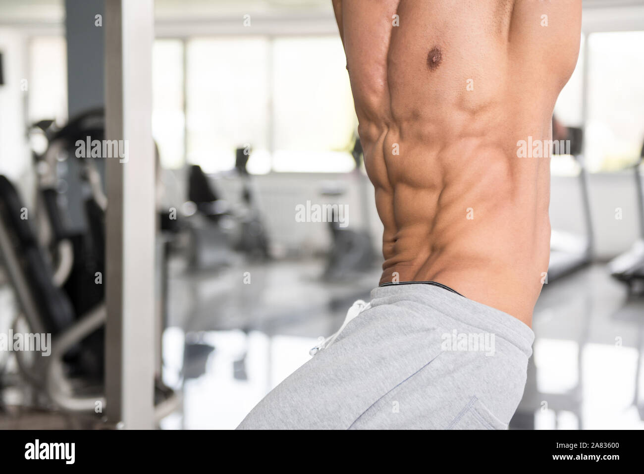 Model Performing Hanging Leg Raises Exercise - One Of The Most ...