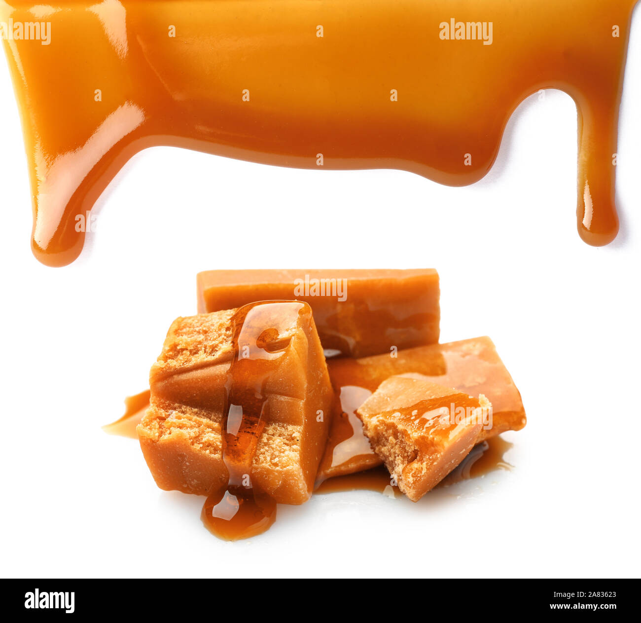 Tasty caramel candies and stains on white background Stock Photo - Alamy