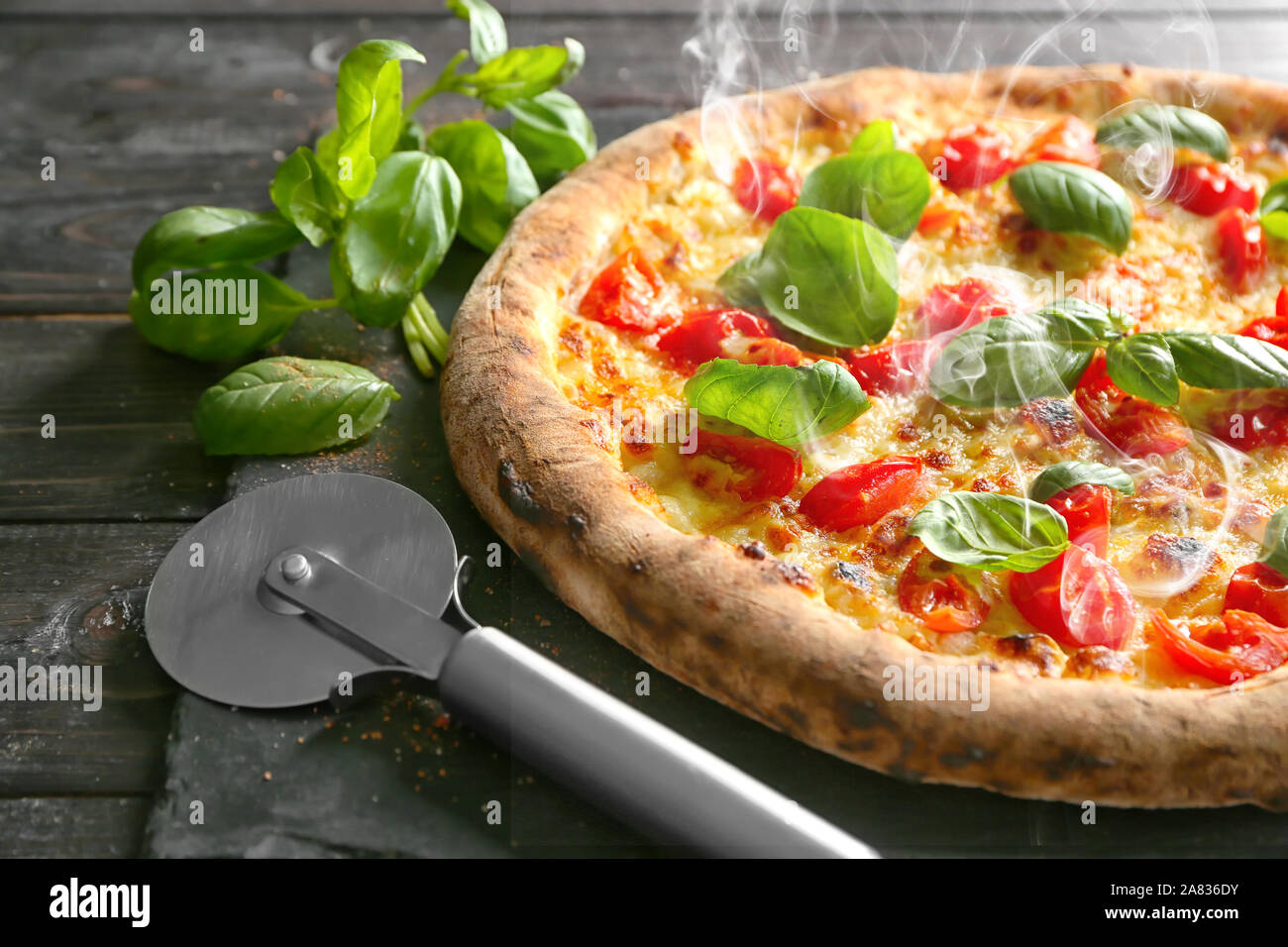 Delicious hot pizza on table Stock Photo - Alamy