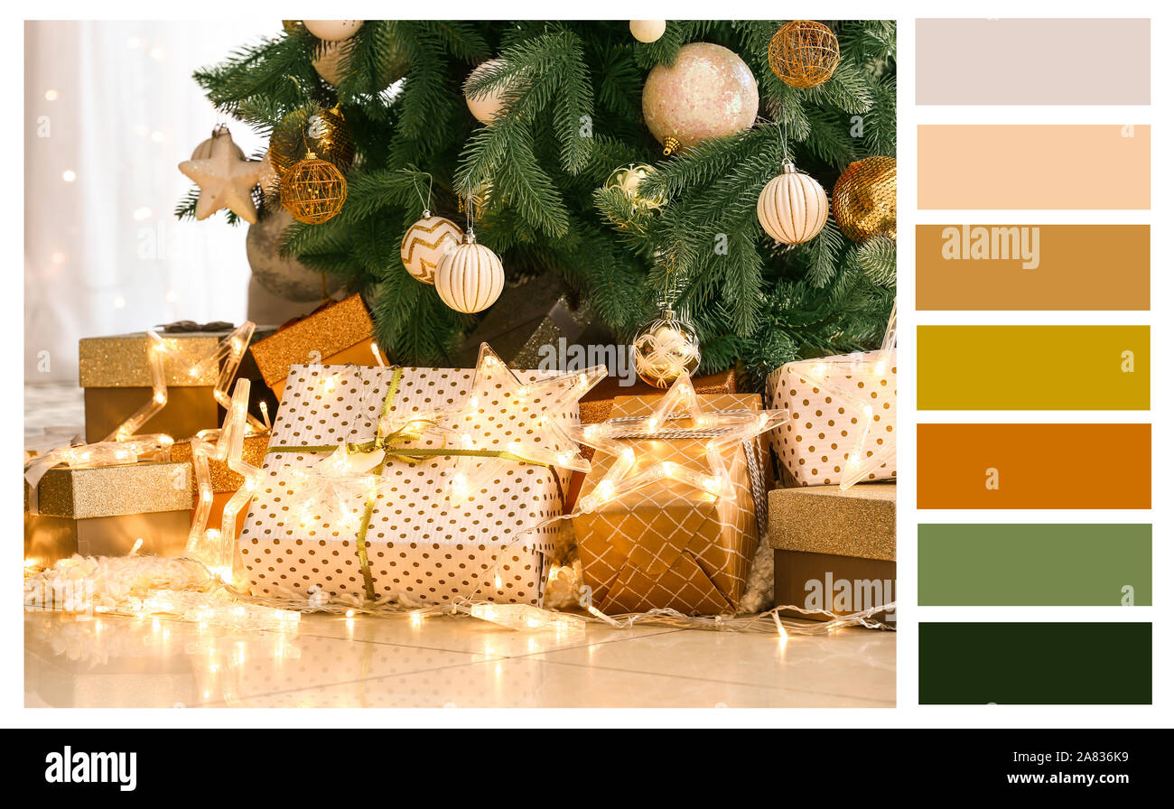 Many beautiful gift boxes under Christmas tree. Different color ...