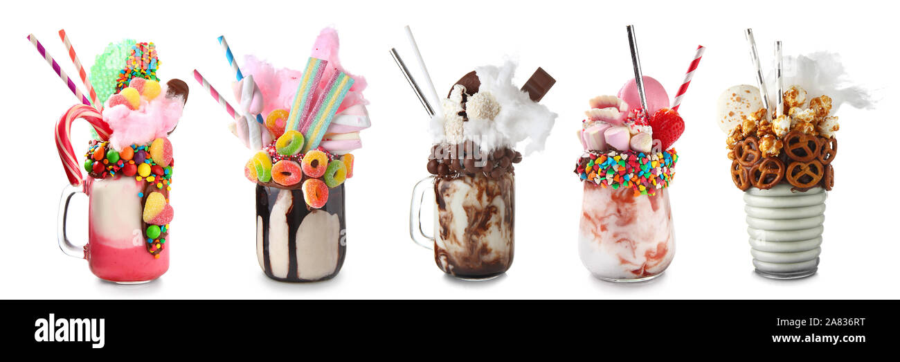Different delicious freak shakes on white background Stock Photo - Alamy
