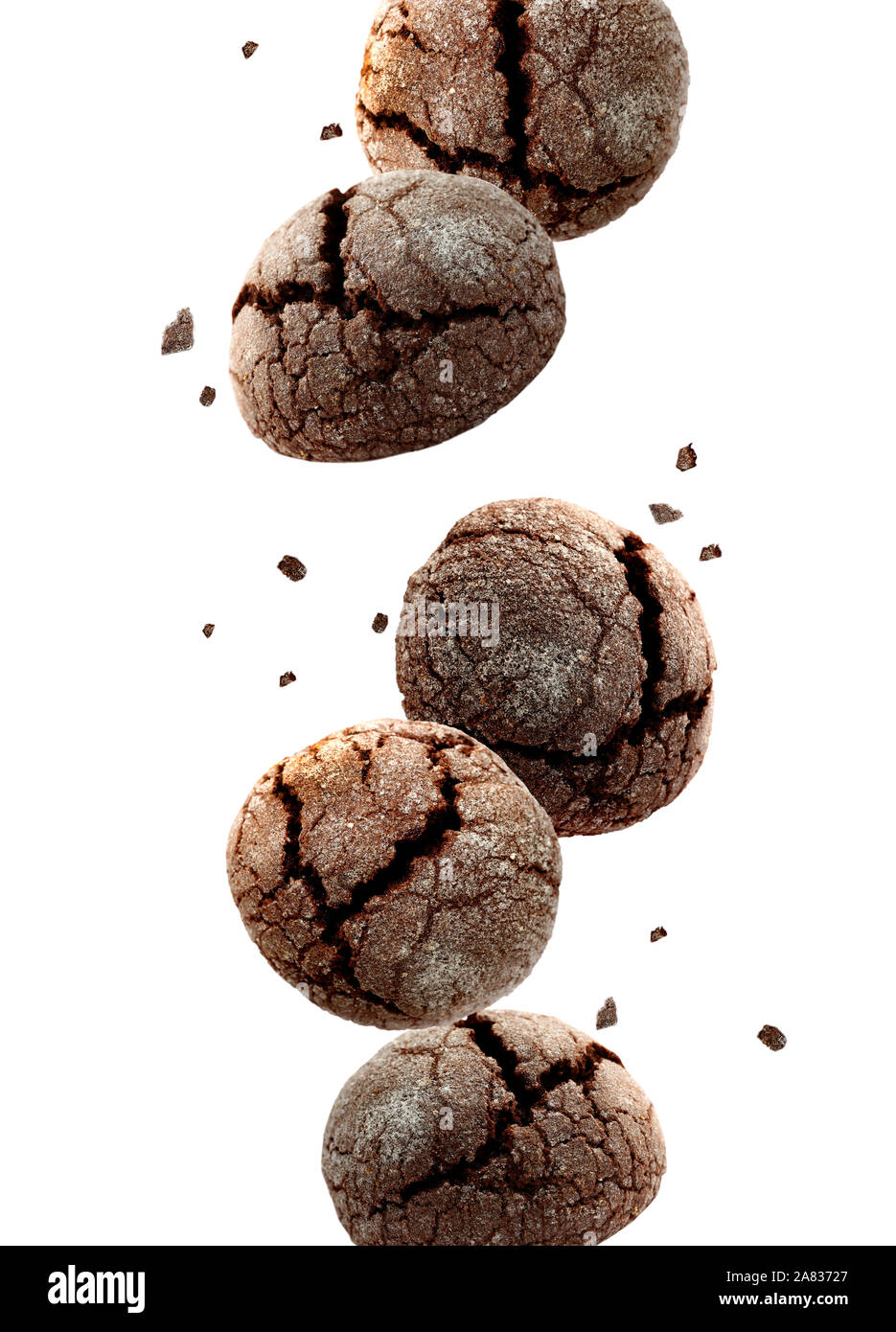 Falling chocolate cookies on white background Stock Photo - Alamy