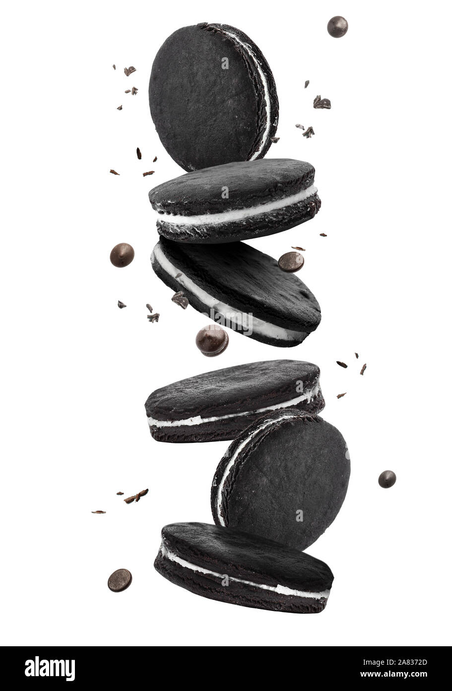 Falling chocolate cookies on white background Stock Photo - Alamy
