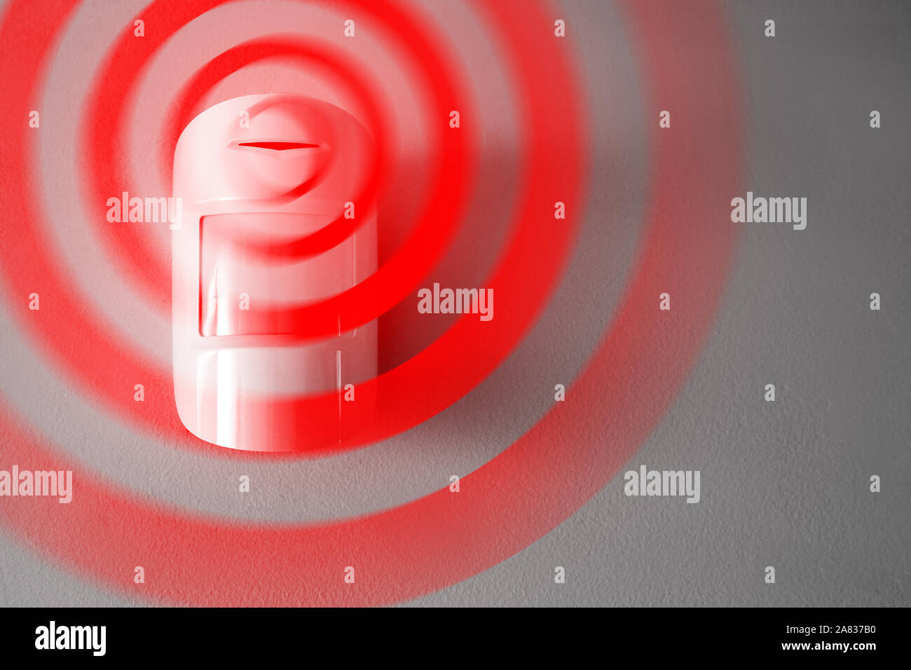 Modern motion sensor in action indoors Stock Photo - Alamy