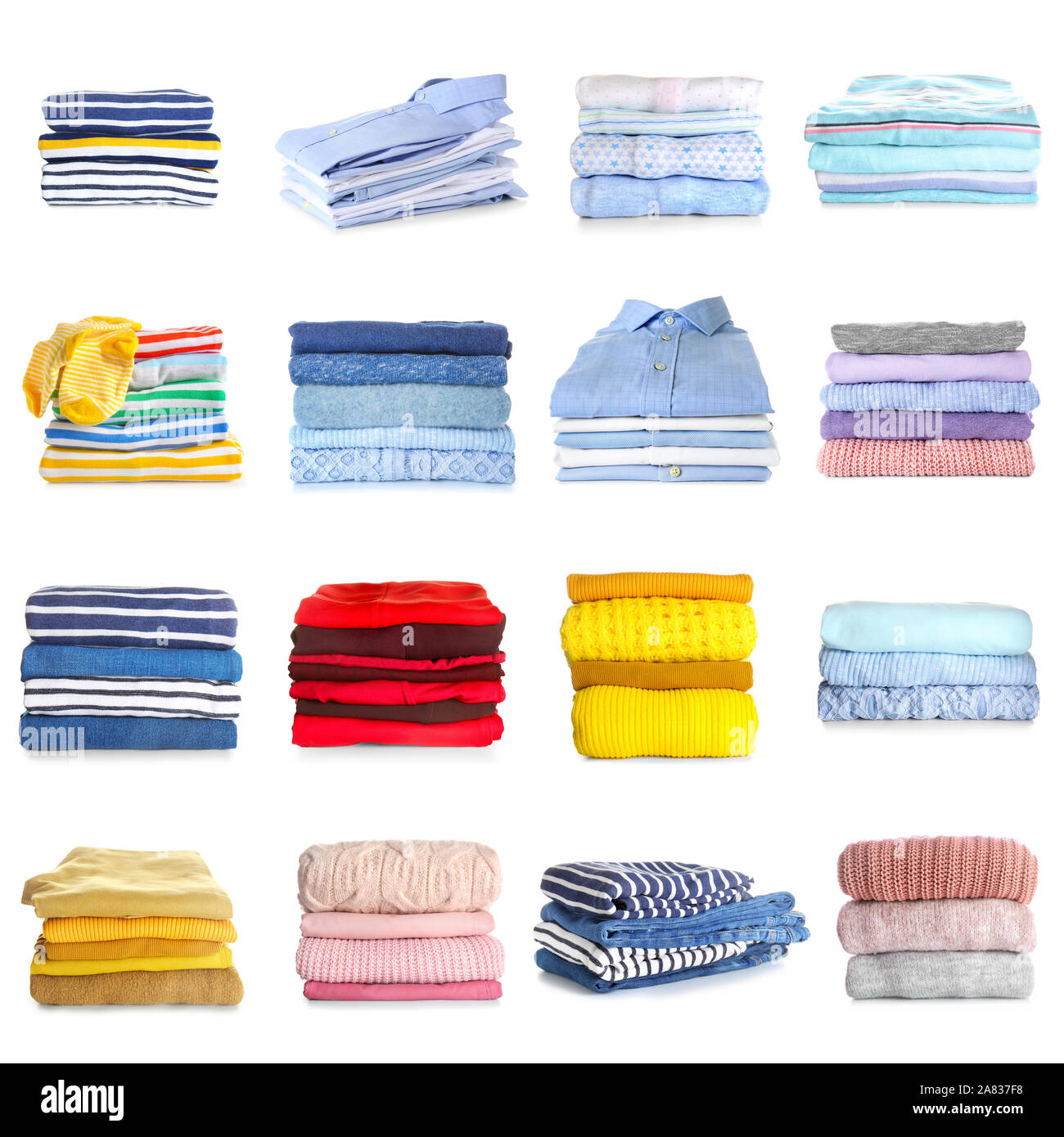 Stacks of modern different clothes on white background Stock Photo - Alamy