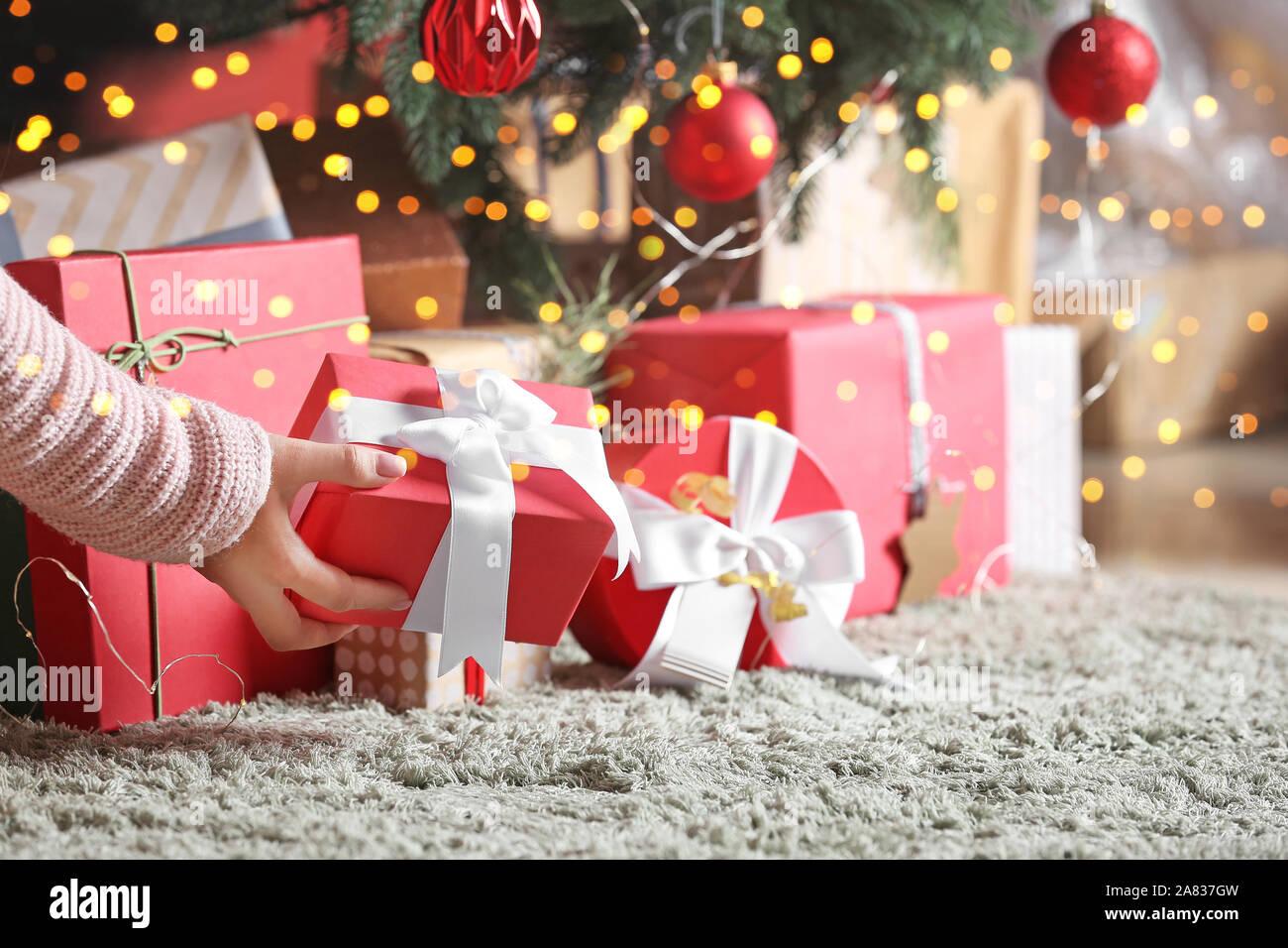 Woman putting gift boxes hi-res stock photography and images - Alamy