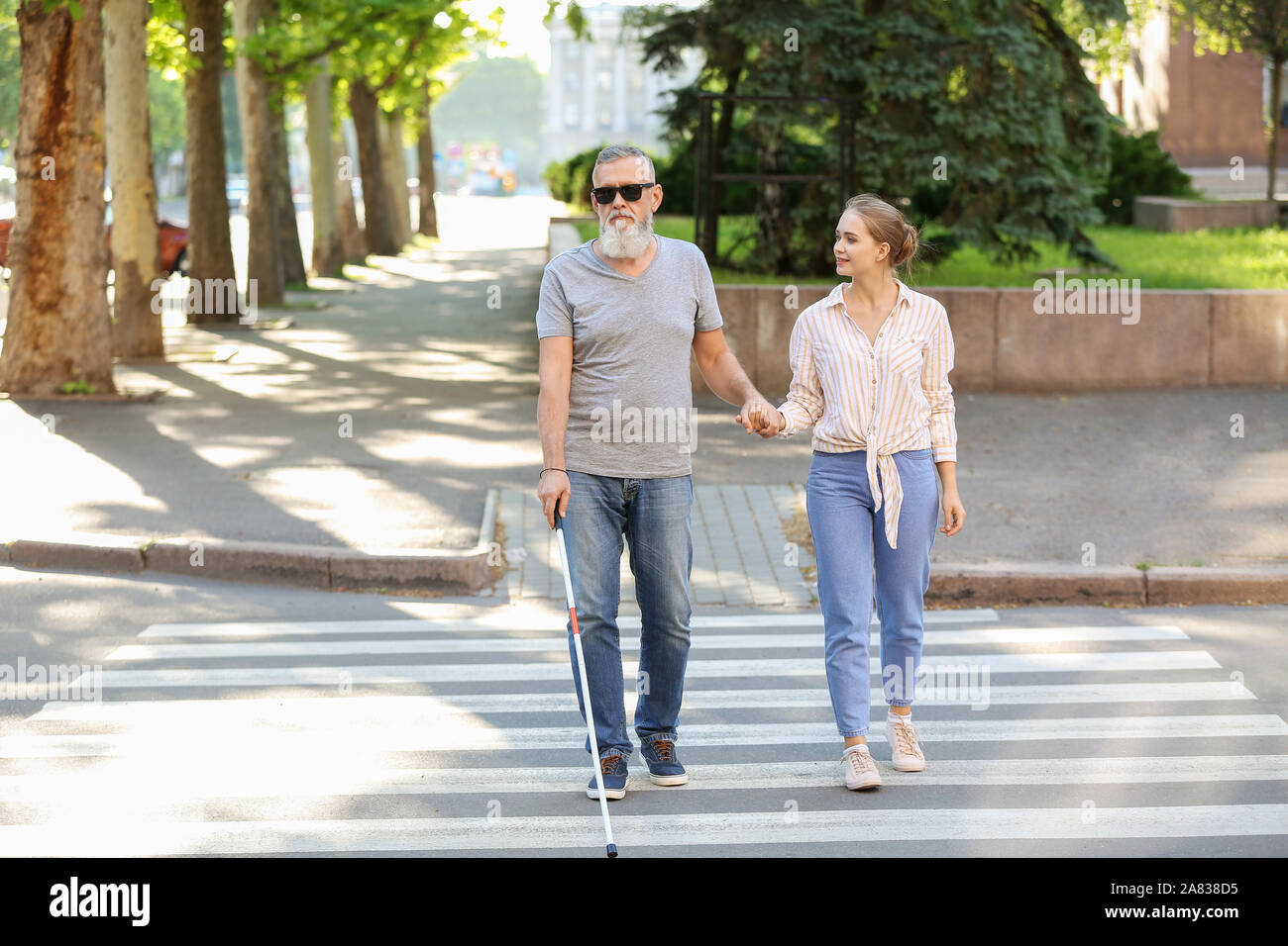 Helping person cross the street hi-res stock photography and images - Alamy