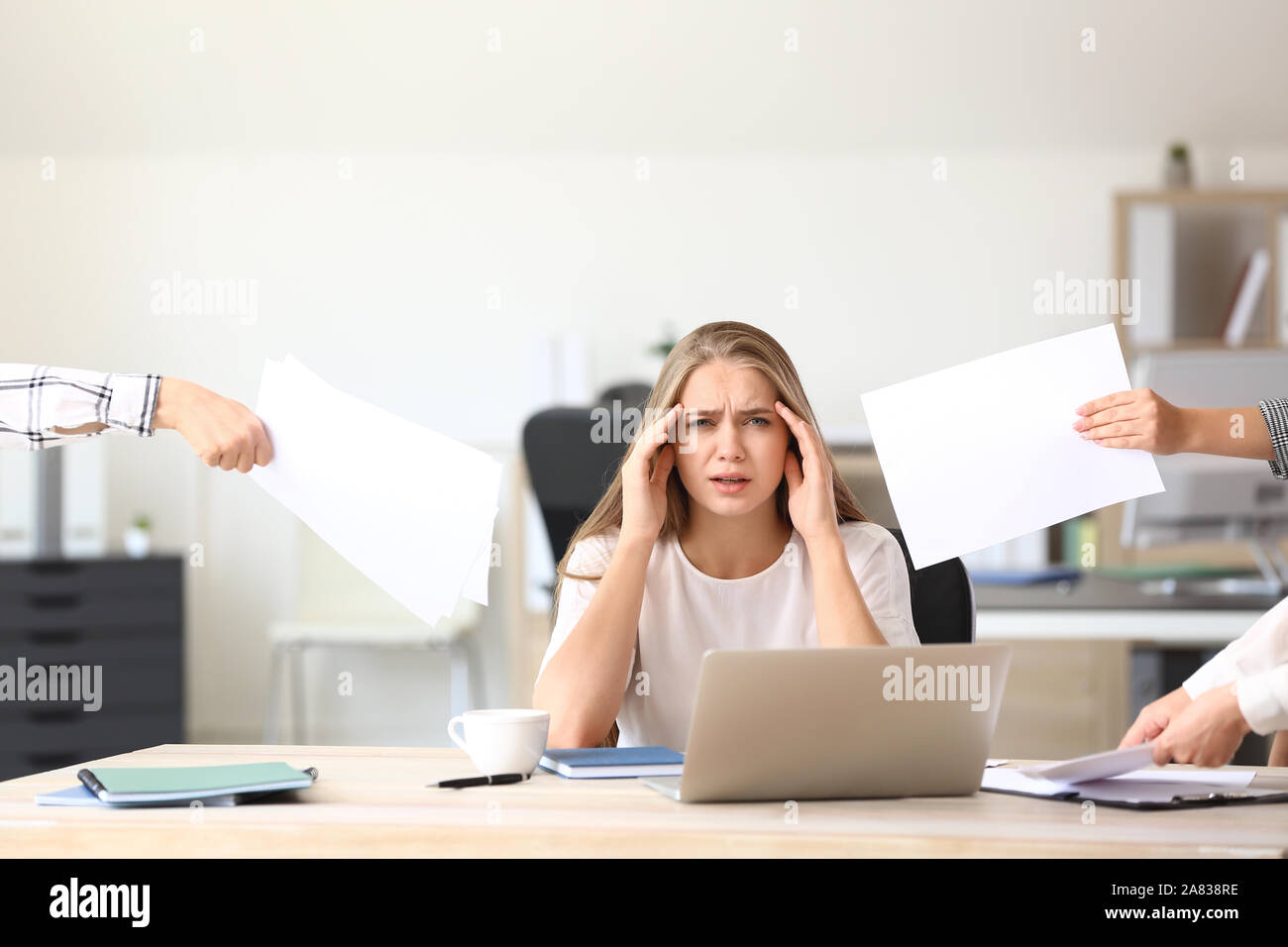 Woman having panic attack at workplace Stock Photo - Alamy