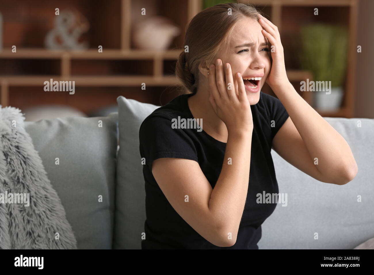 Woman having panic attack at home Stock Photo - Alamy