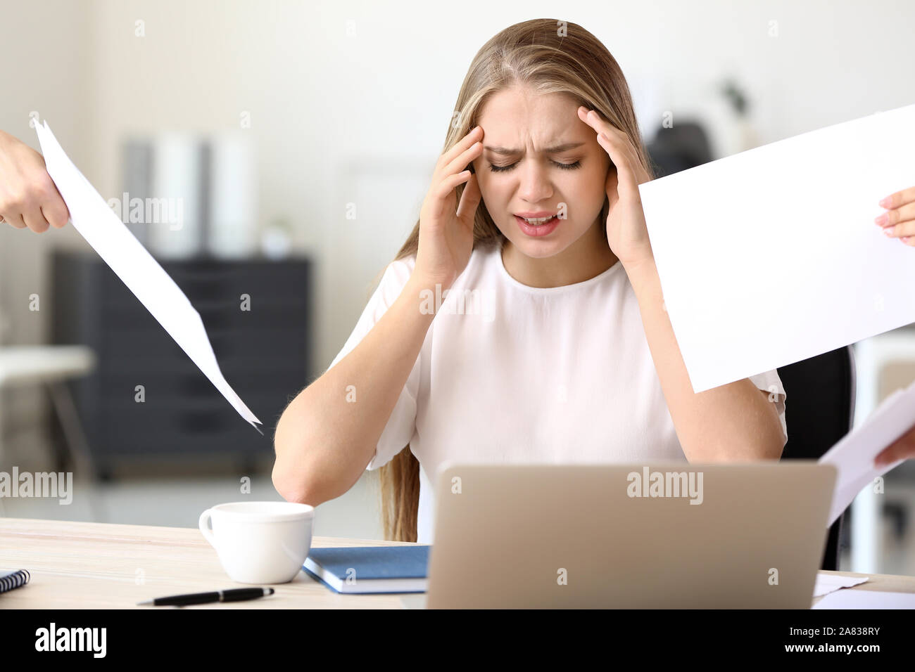 Woman having panic attack at workplace Stock Photo - Alamy