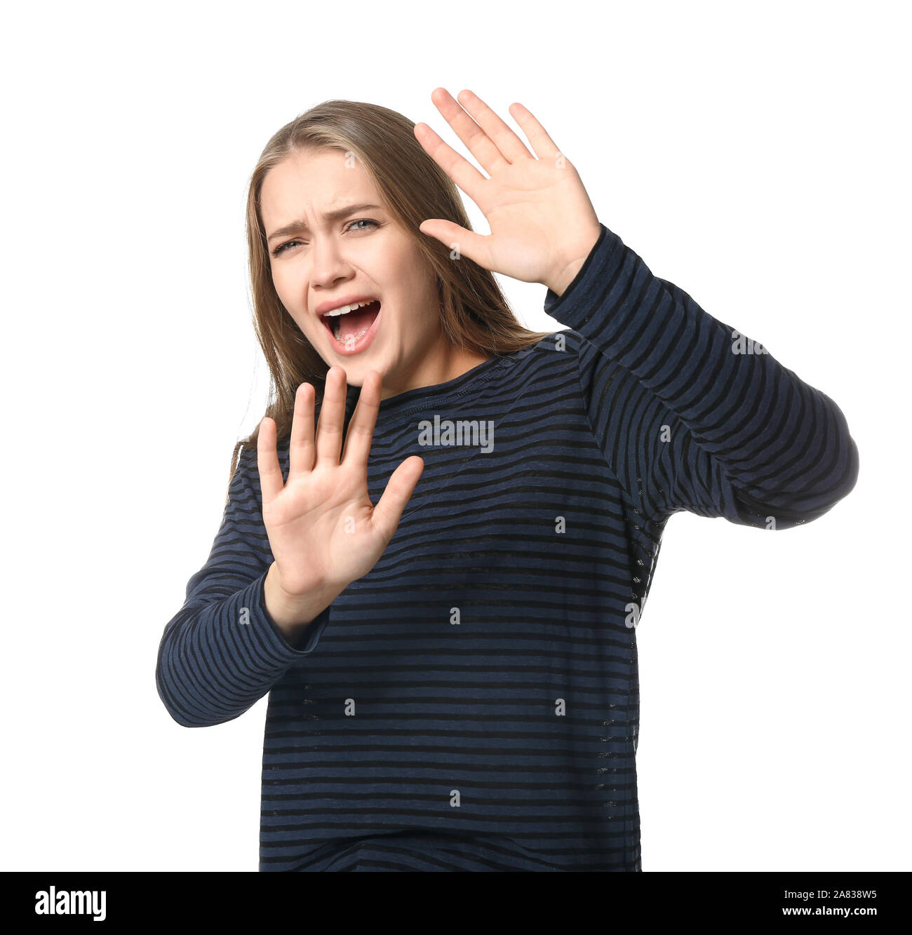 Woman having panic attack on white background Stock Photo - Alamy