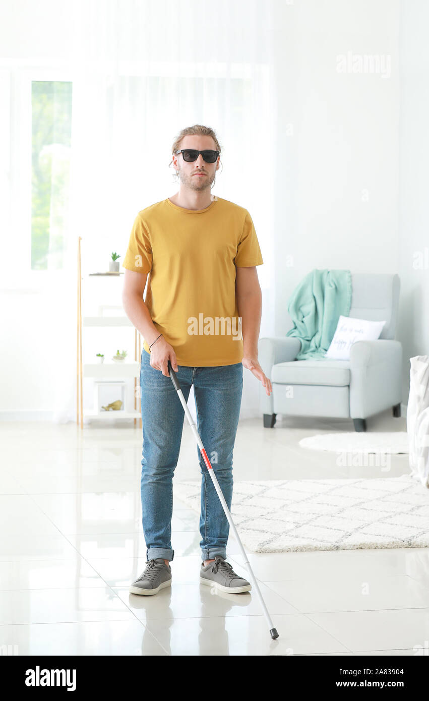 Blind young man at home Stock Photo - Alamy