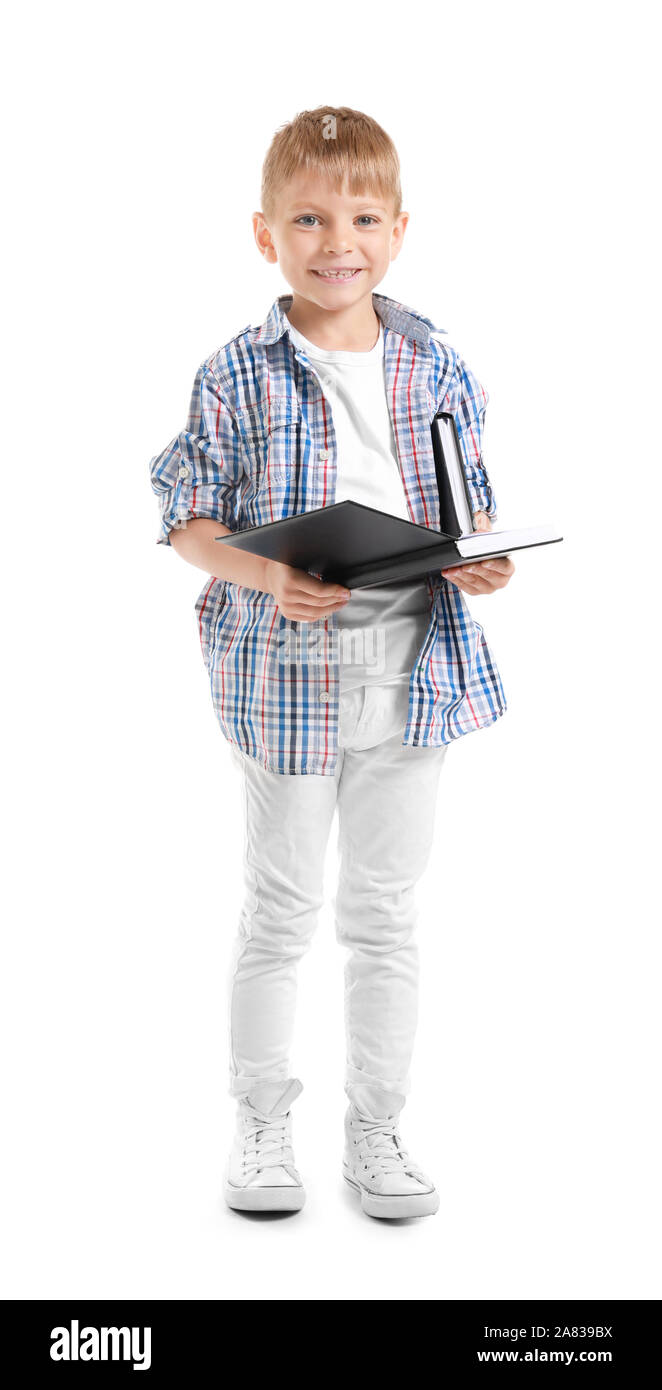 Cute little boy with books on white background Stock Photo - Alamy
