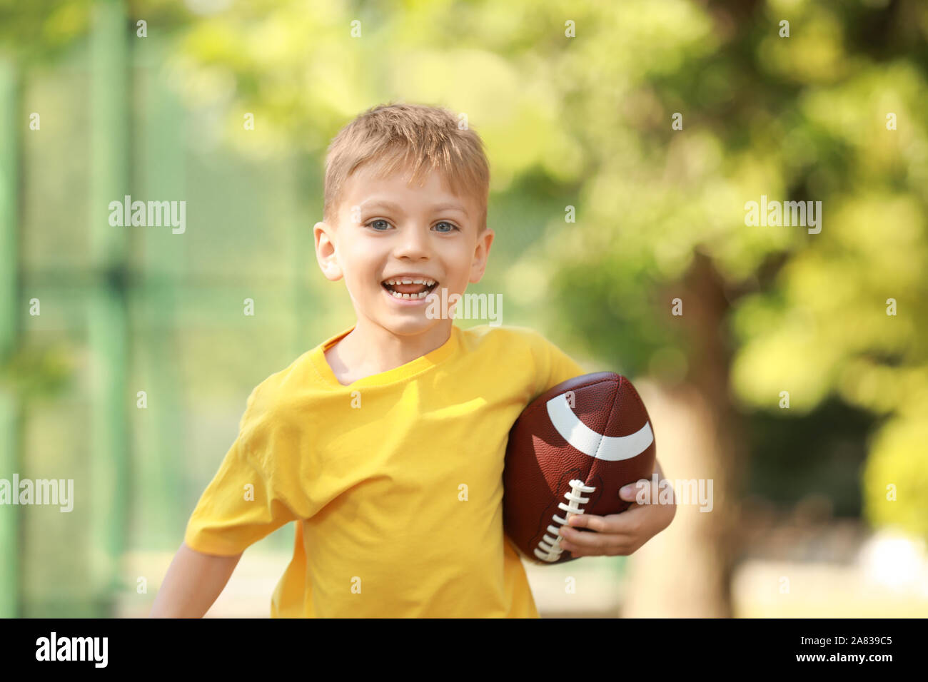 Boy rugby ball hi-res stock photography and images - Alamy