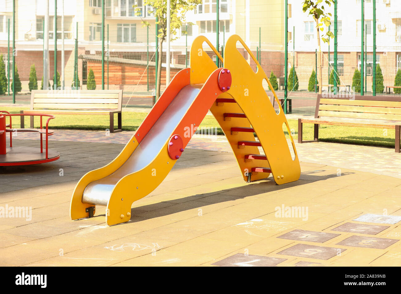 Slide on playground in park Stock Photo - Alamy