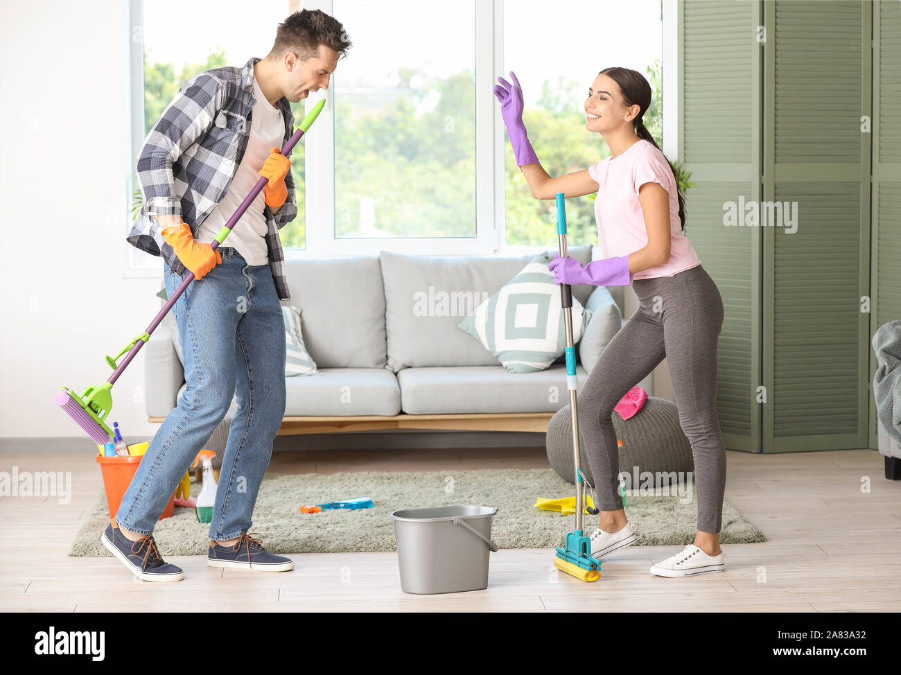 Couple having fun cleaning hi-res stock photography and images - Alamy