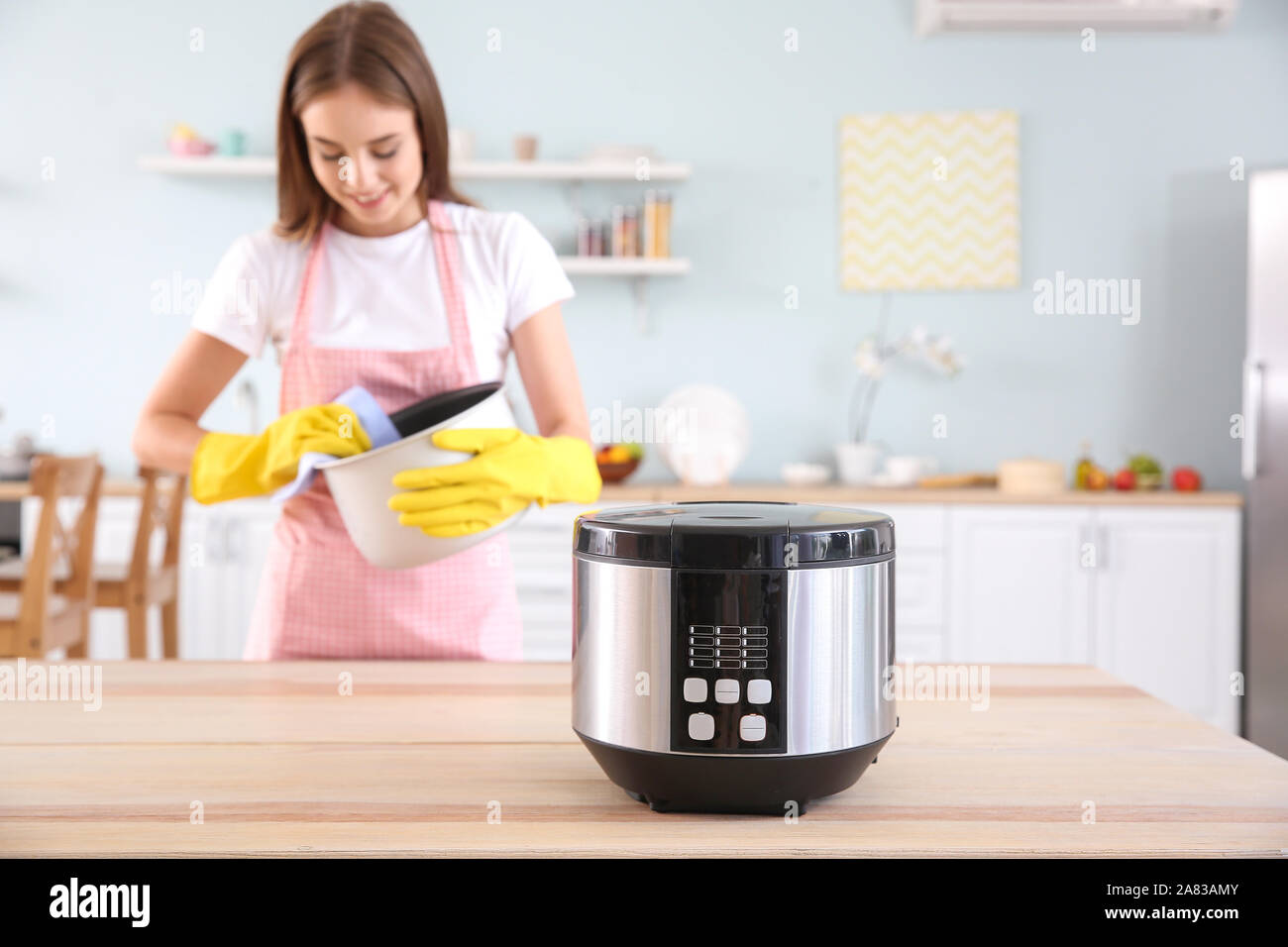 Woman cooking pot cleaning hi-res stock photography and images - Alamy