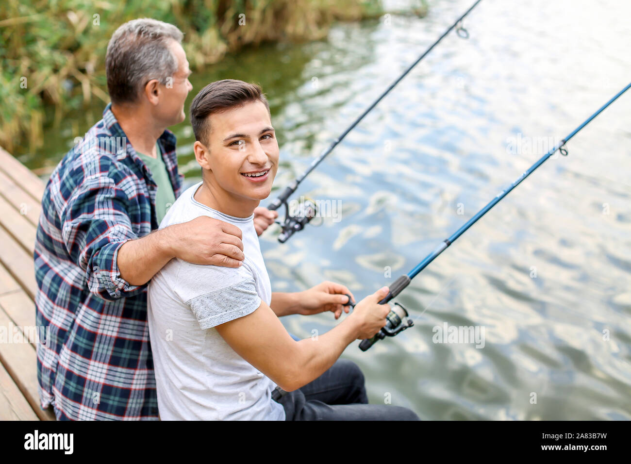 Man hugging fish hi-res stock photography and images - Alamy