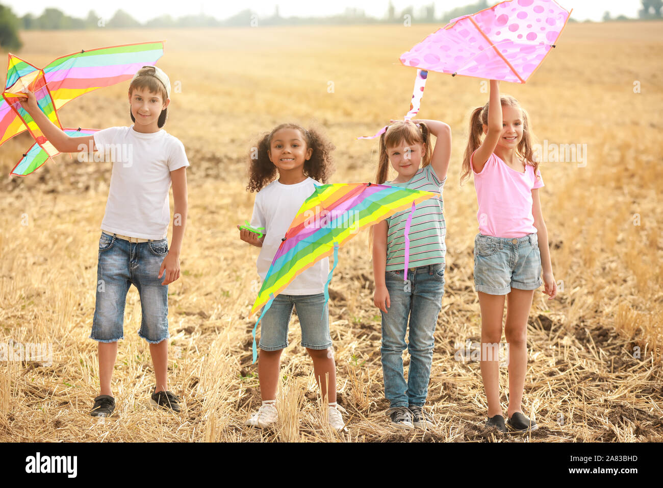 Little children flying kites outdoors Stock Photo - Alamy