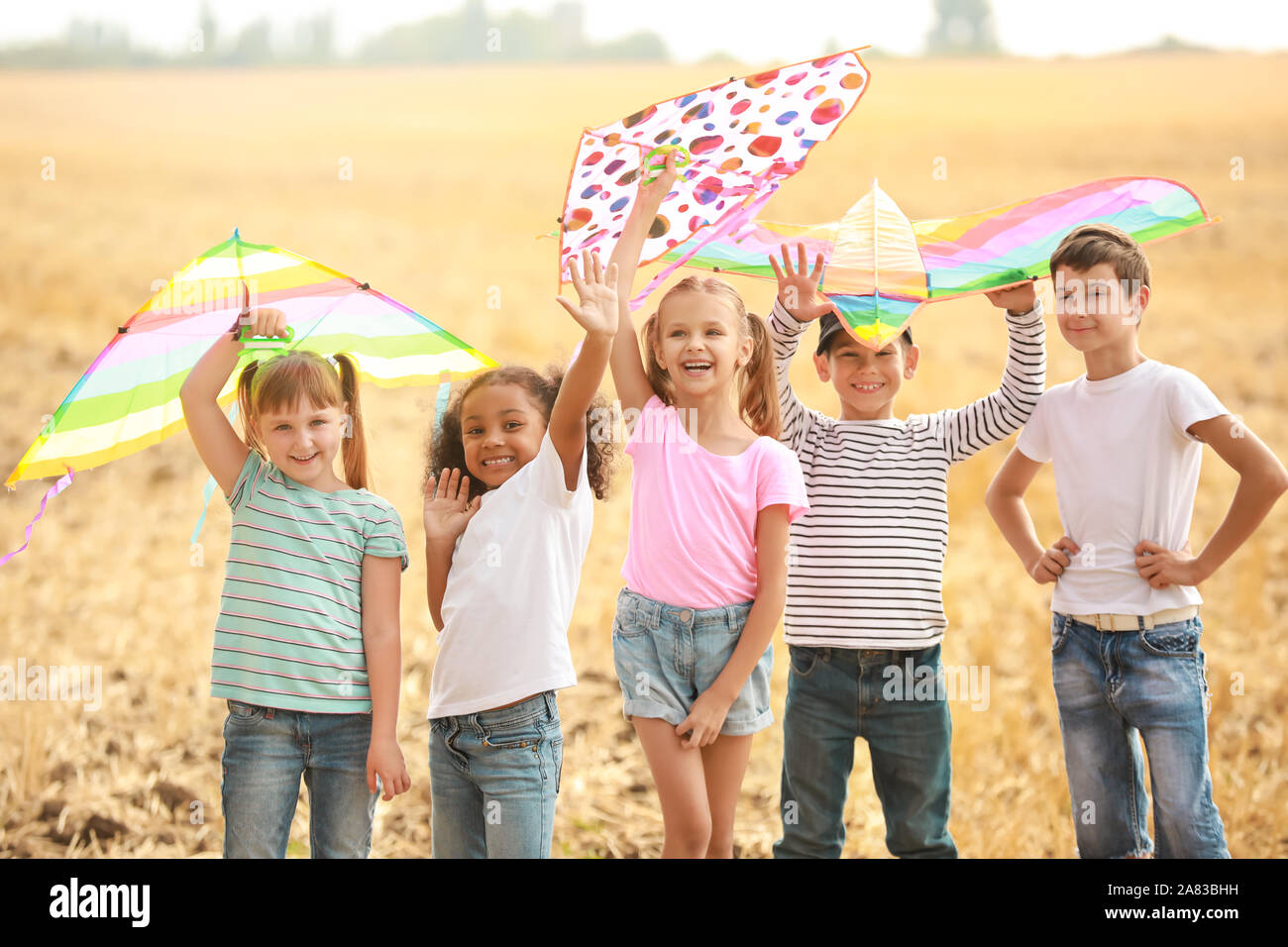 Little children flying kites outdoors Stock Photo - Alamy