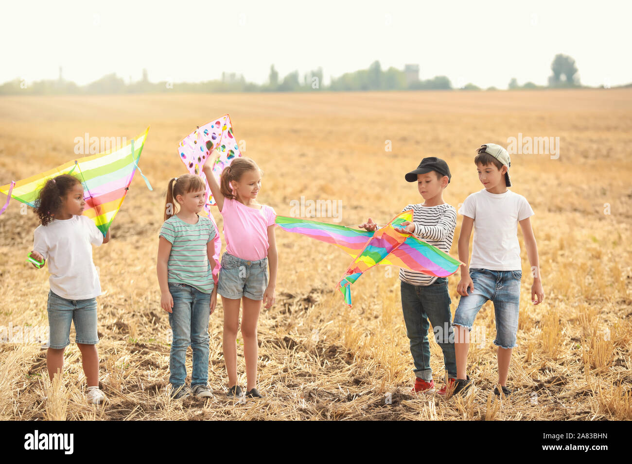 Little children flying kites outdoors Stock Photo - Alamy