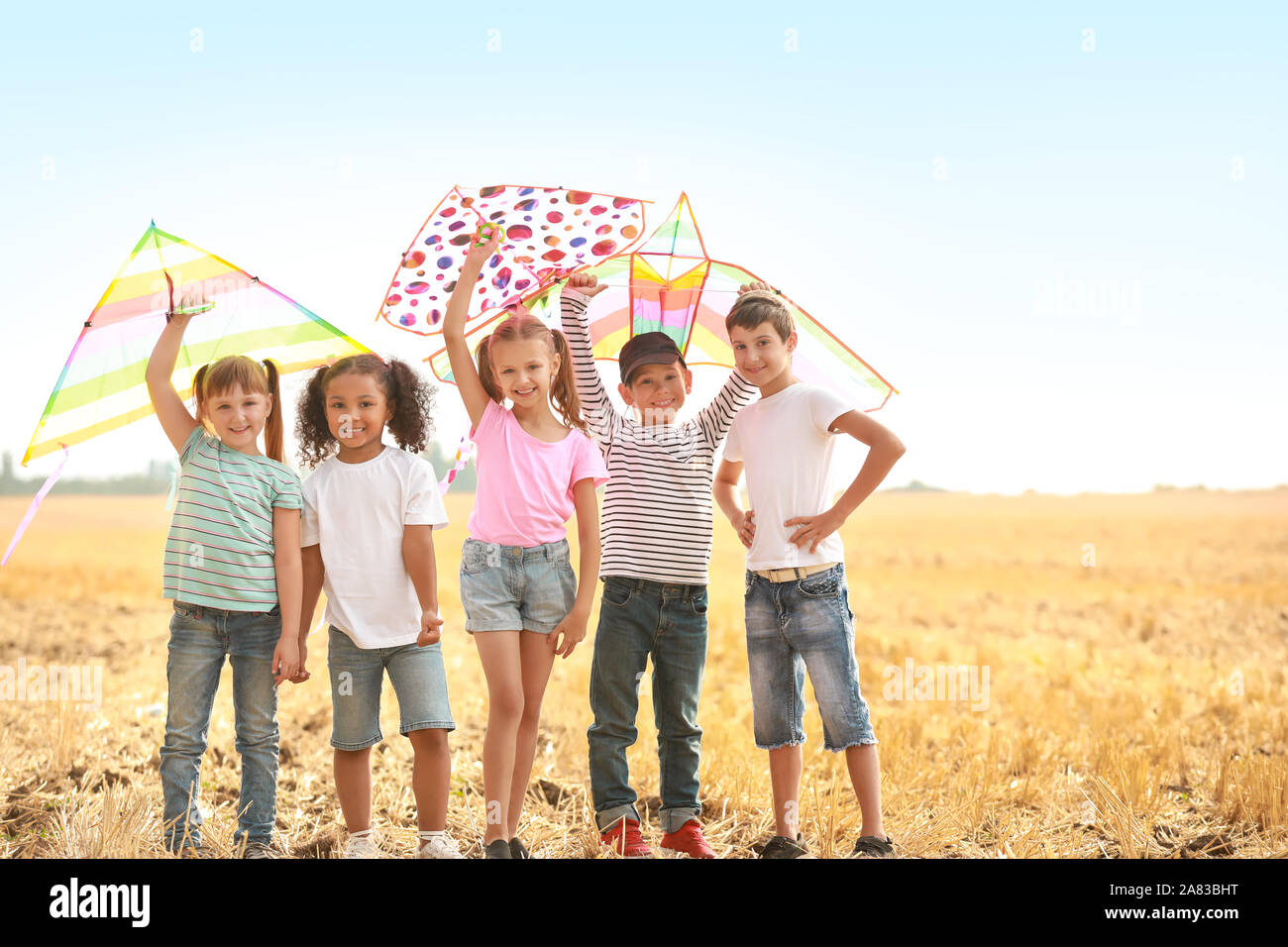 Little children flying kites outdoors Stock Photo - Alamy