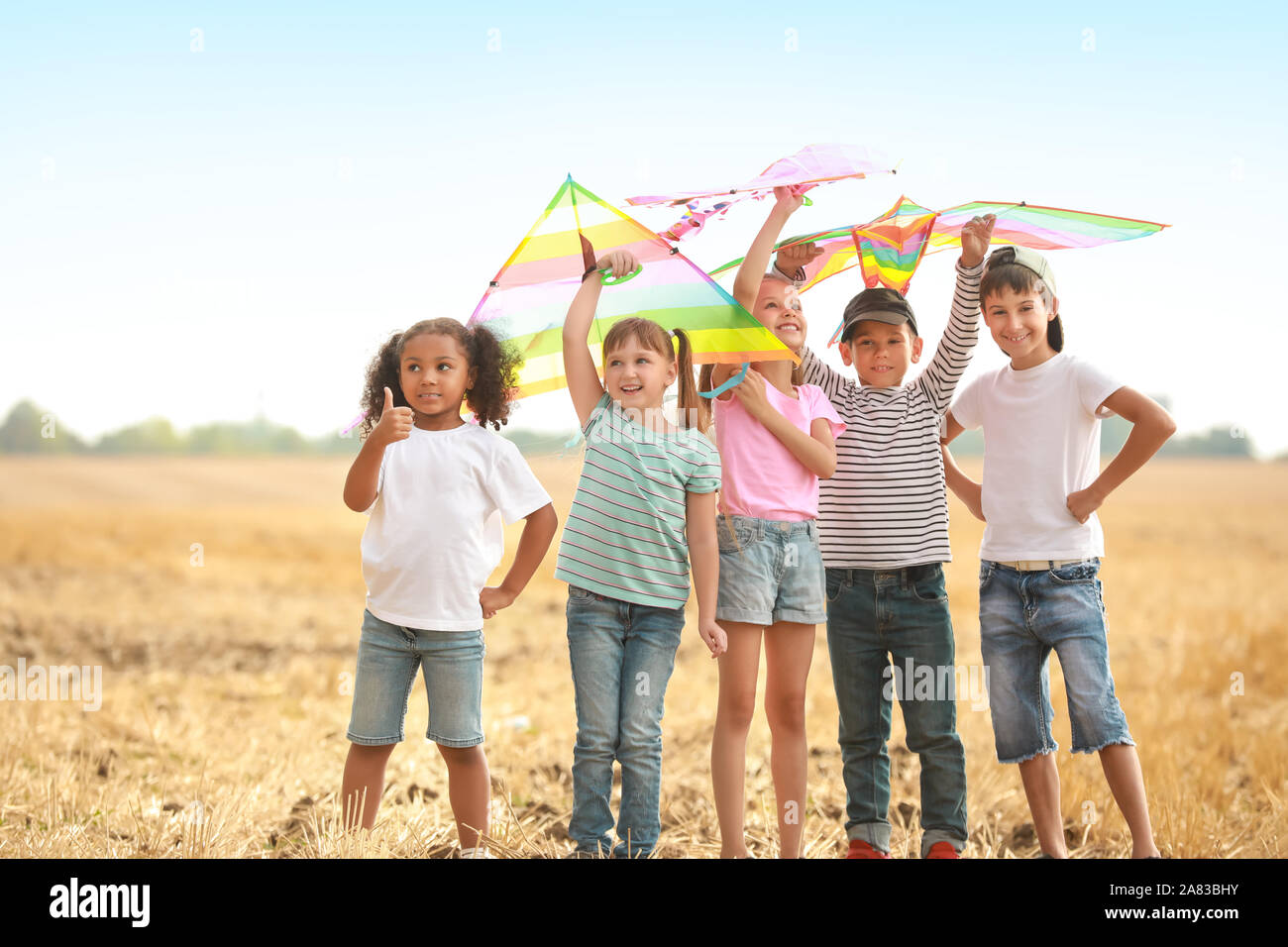 Little children flying kites outdoors Stock Photo - Alamy
