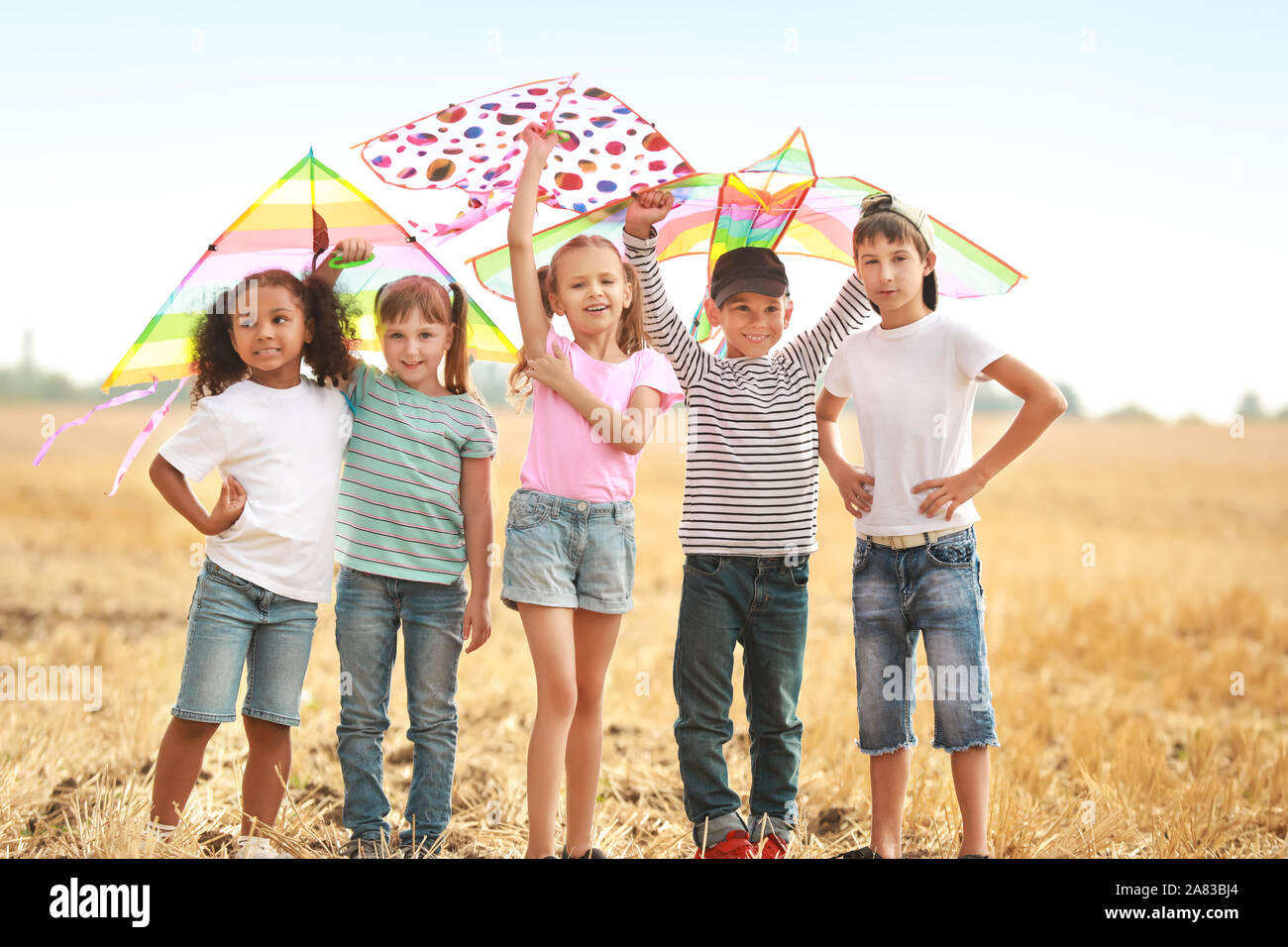 Little children flying kites outdoors Stock Photo - Alamy