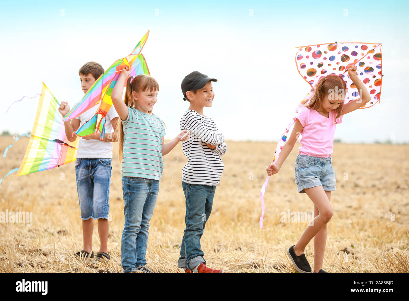 Little children flying kites outdoors Stock Photo - Alamy