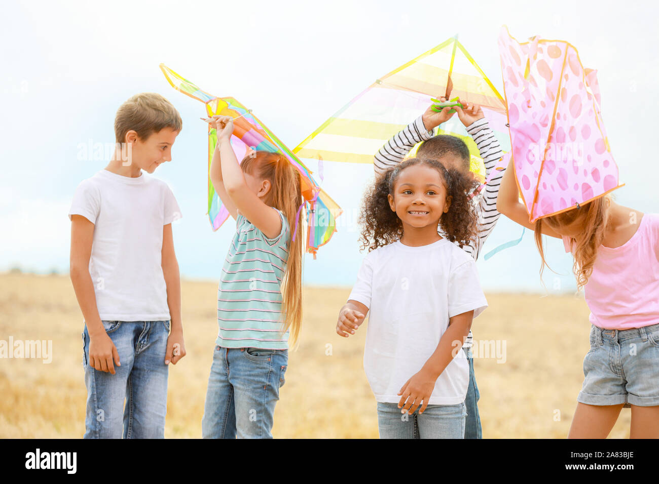 Little children flying kites outdoors Stock Photo - Alamy