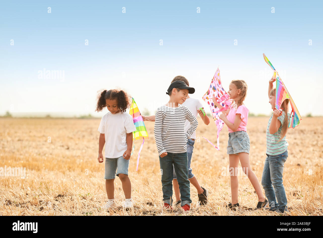 Little children flying kites outdoors Stock Photo - Alamy