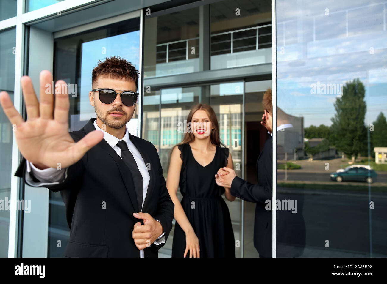 Famous celebrity with bodyguards outdoors Stock Photo - Alamy